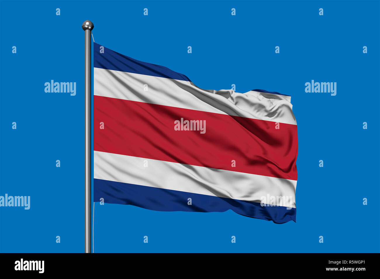 Flag of Costa Rica waving in the wind against deep blue sky. Costa ...