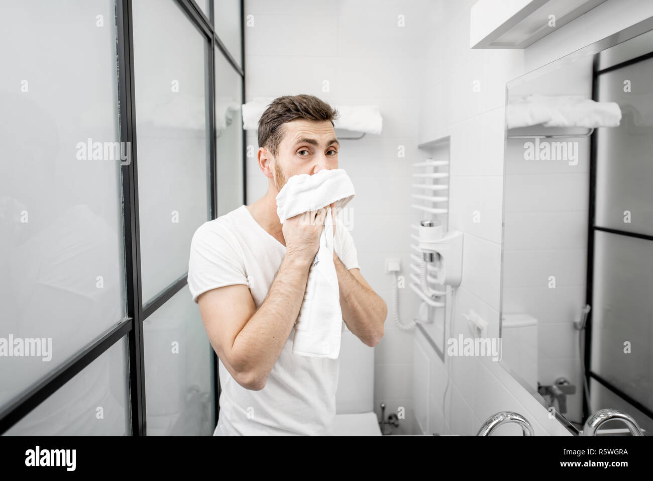 Man drying face towel hi-res stock photography and images - Alamy