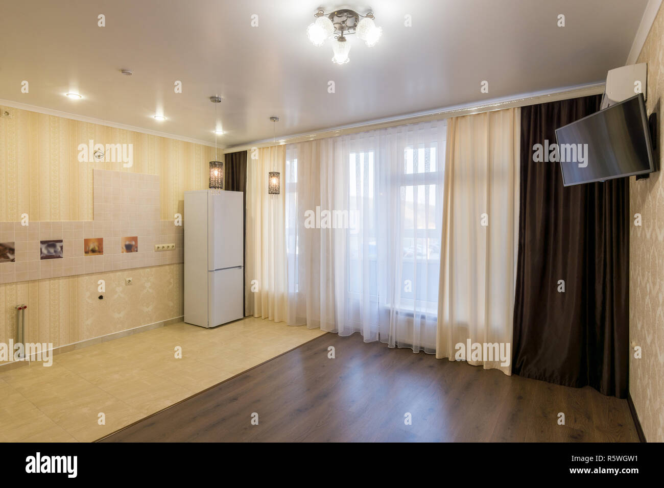 Interior of an empty studio apartment without furniture Stock Photo - Alamy