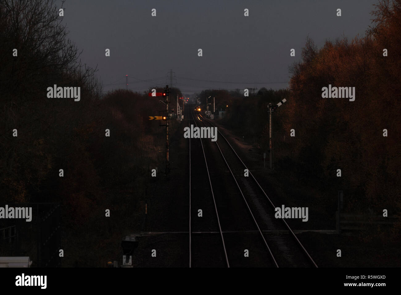 A Northern rail class 158 sprinter train at Gilberdyke at dusk night ...