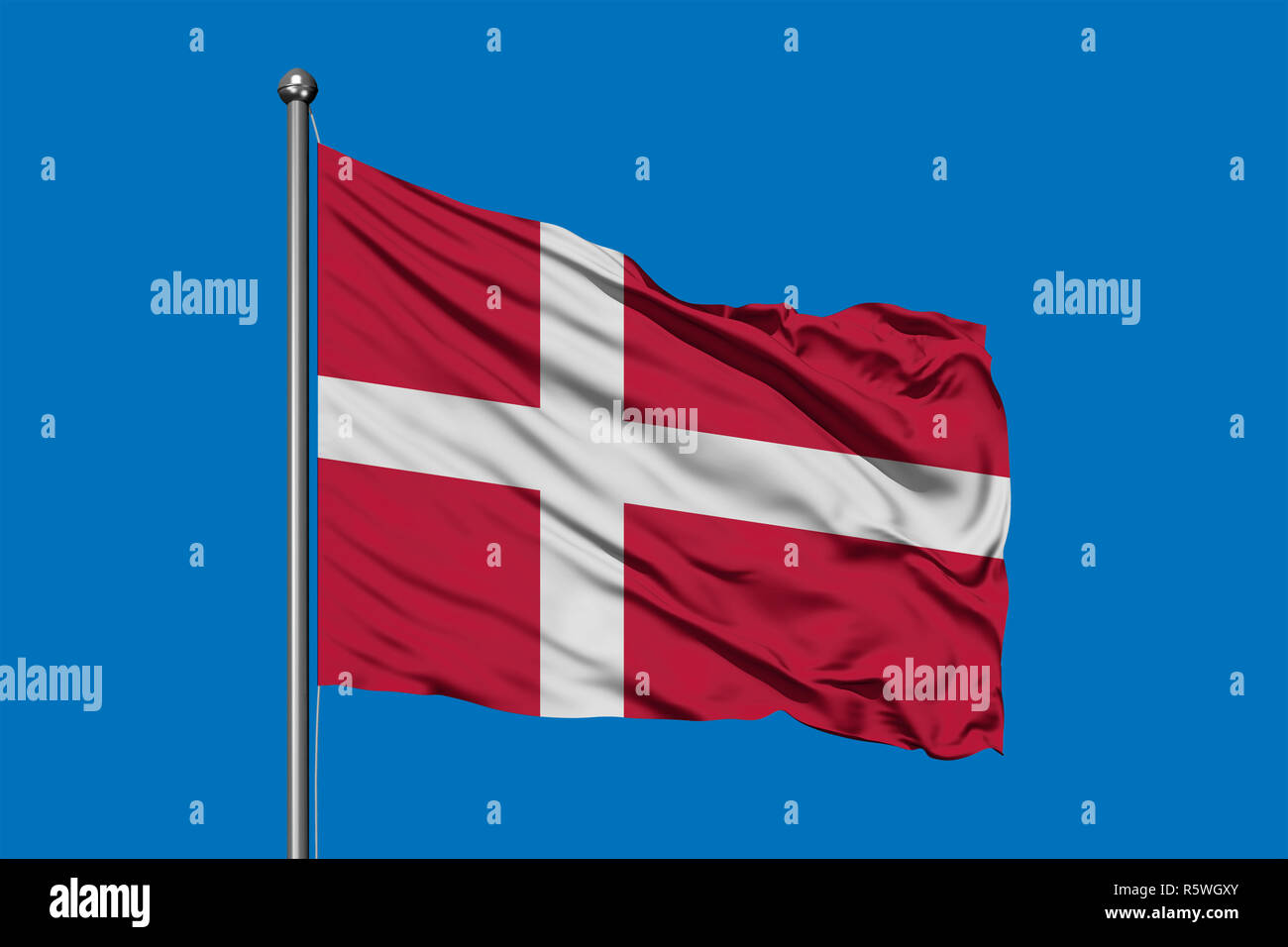 Flag of Denmark waving in the wind against deep blue sky. Danish flag ...