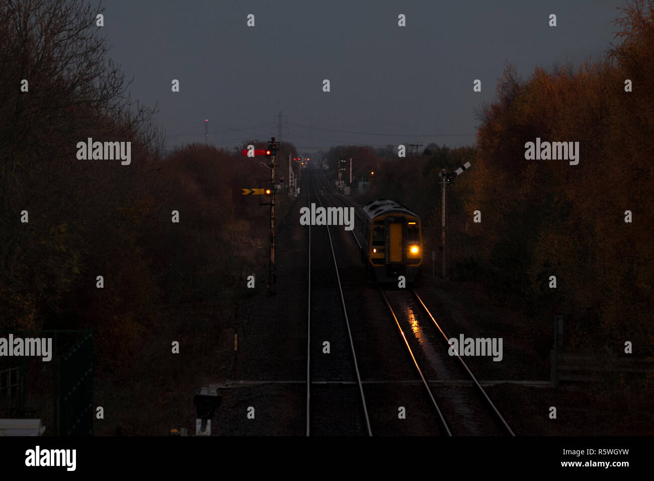 A Northern rail class 158 sprinter train at Gilberdyke at dusk night ...