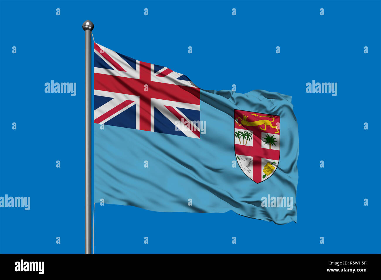 Flag of Fiji waving in the wind against deep blue sky. Fijian flag Stock Photo - Alamy