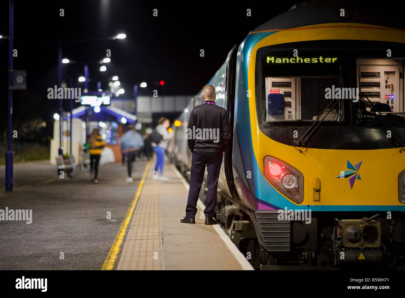 The guard / conductor of a First Transpennine express train carrying ...