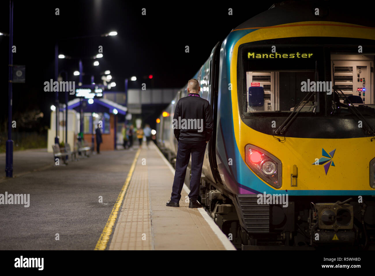 The guard / conductor of a First Transpennine express train carrying ...