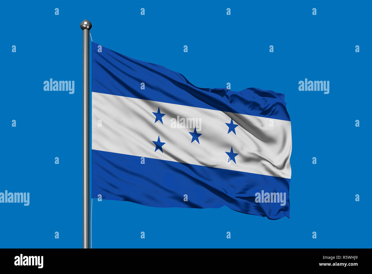 Flag of Honduras waving in the wind against deep blue sky. Honduran ...