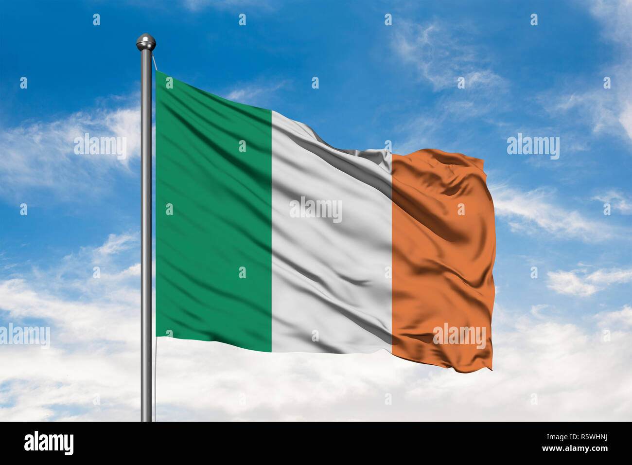 Flag of Ireland waving in the wind against white cloudy blue sky. Irish ...