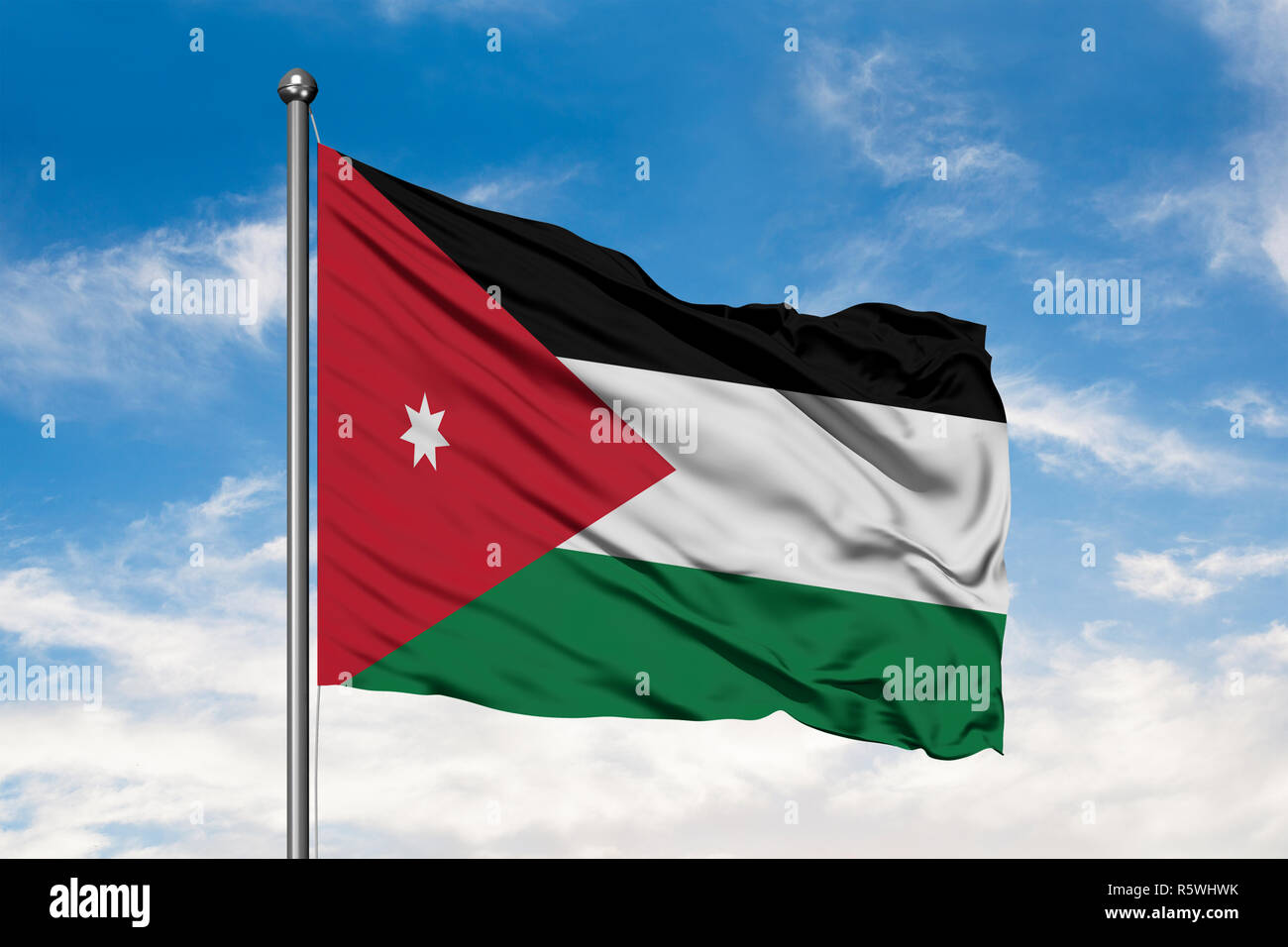 Flag of Jordan waving in the wind against white cloudy blue sky ...
