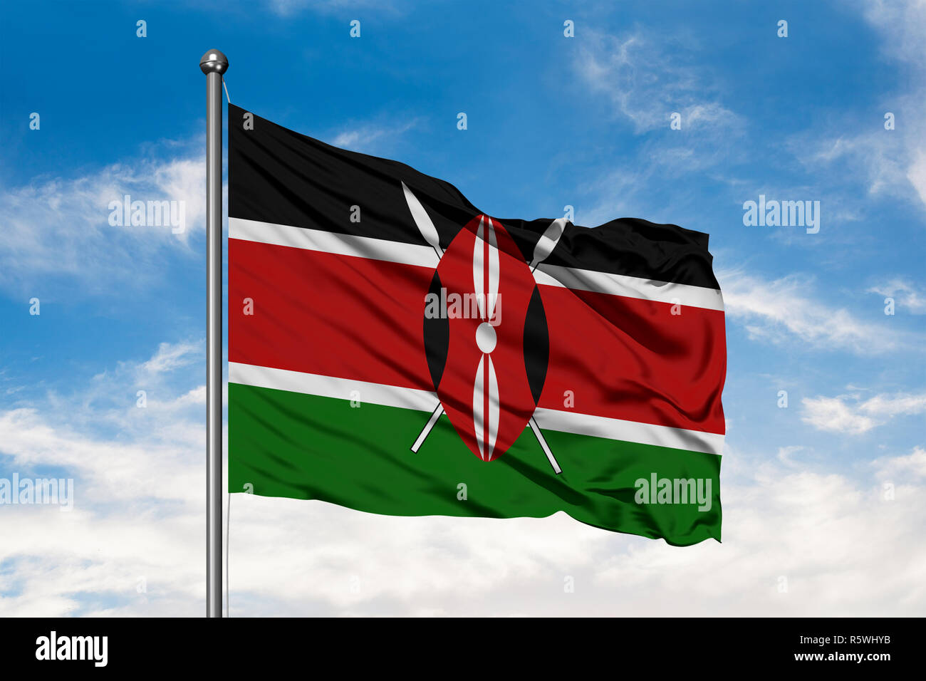 Flag of Kenya waving in the wind against white cloudy blue sky. Kenyan ...