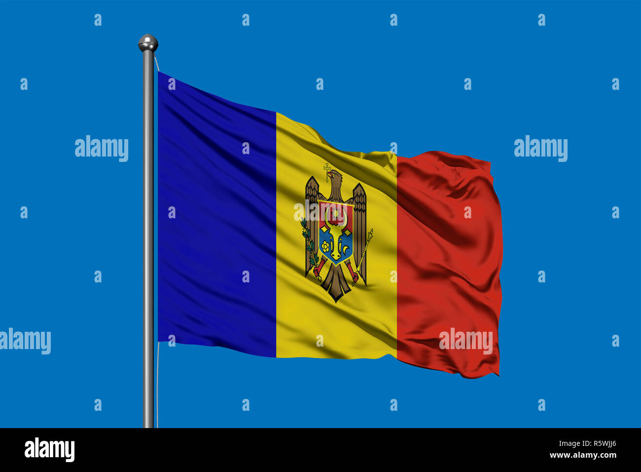 Flag of Moldova waving in the wind against deep blue sky. Moldovan flag ...
