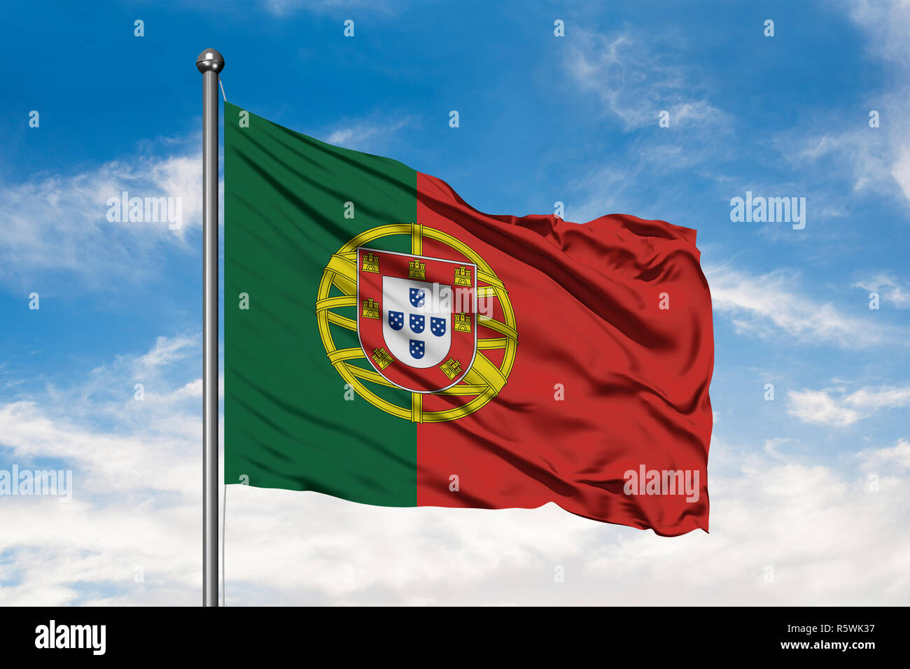 Flag of Portugal waving in the wind against white cloudy blue sky ...