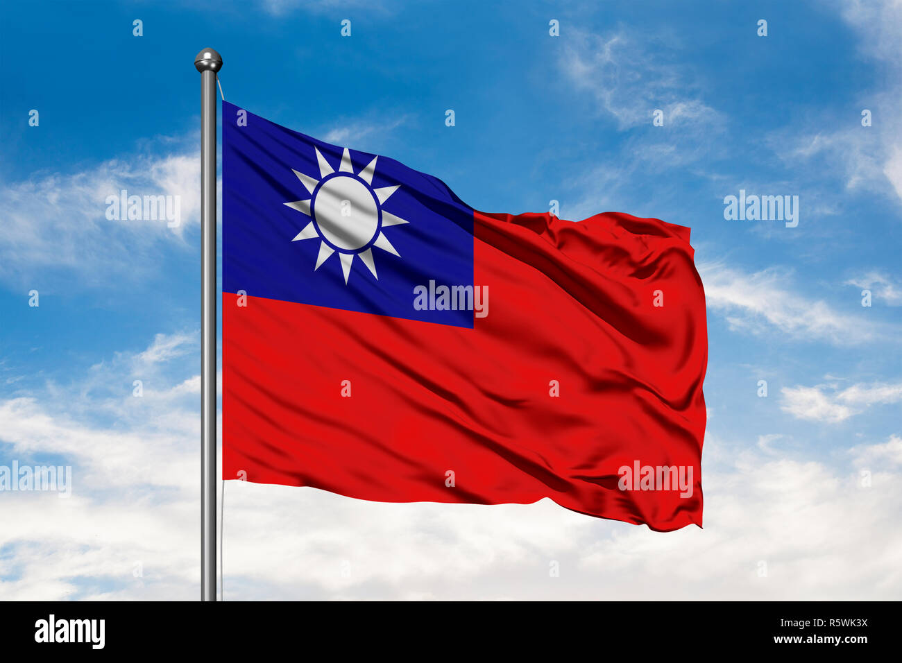 Flag of Taiwan waving in the wind against white cloudy blue sky ...