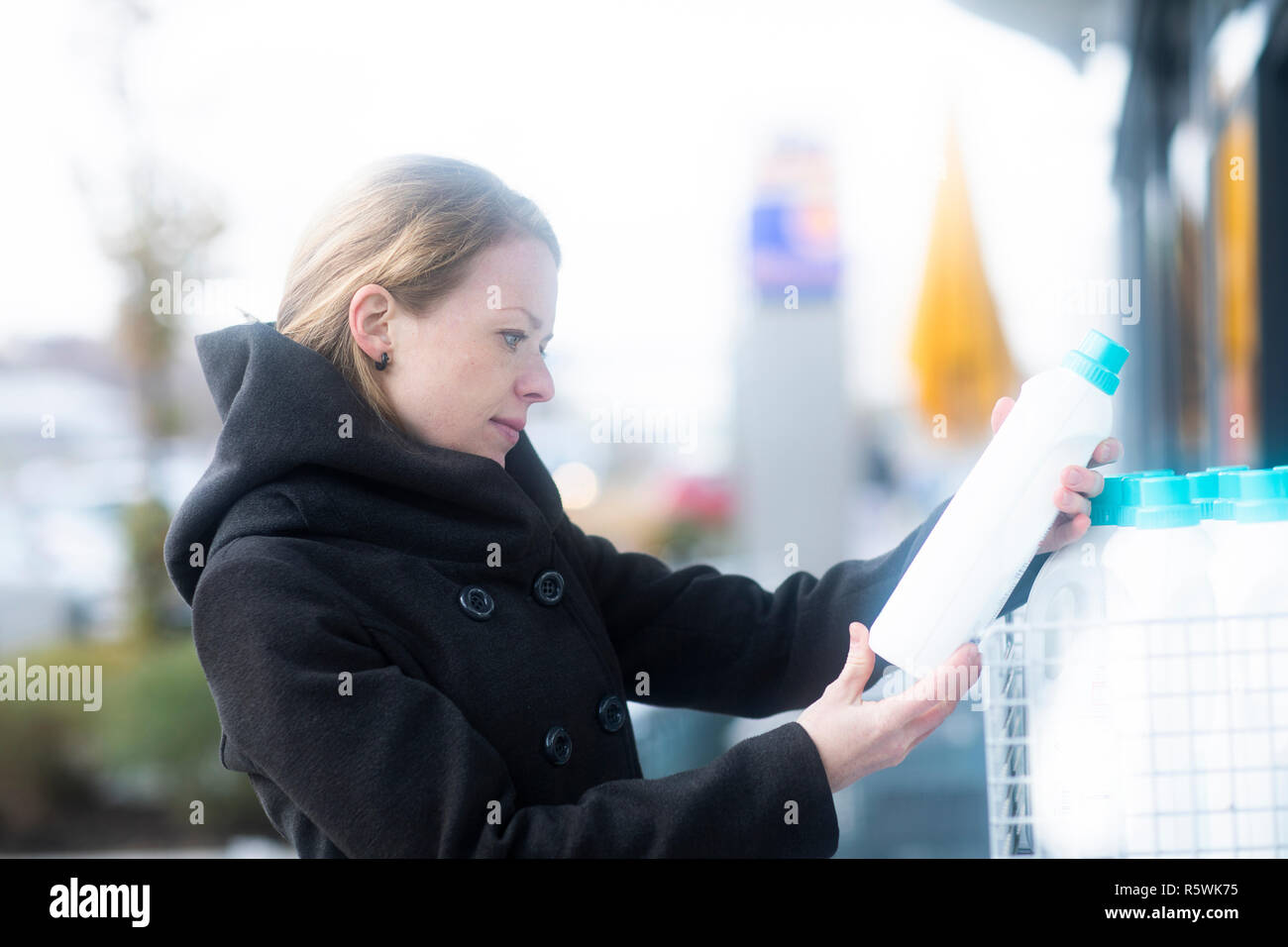 Woman reading ingredients on product hi-res stock photography and ...