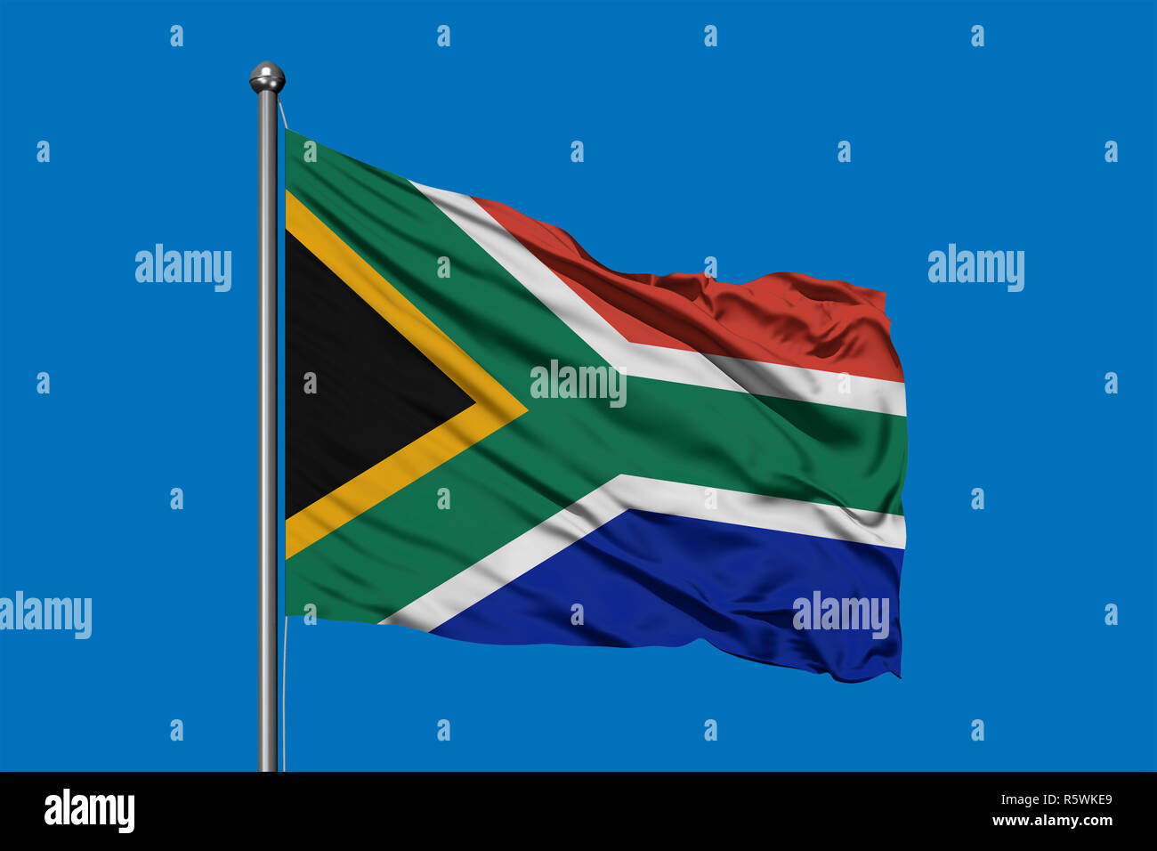 Flag of South Africa waving in the wind against deep blue sky. South ...