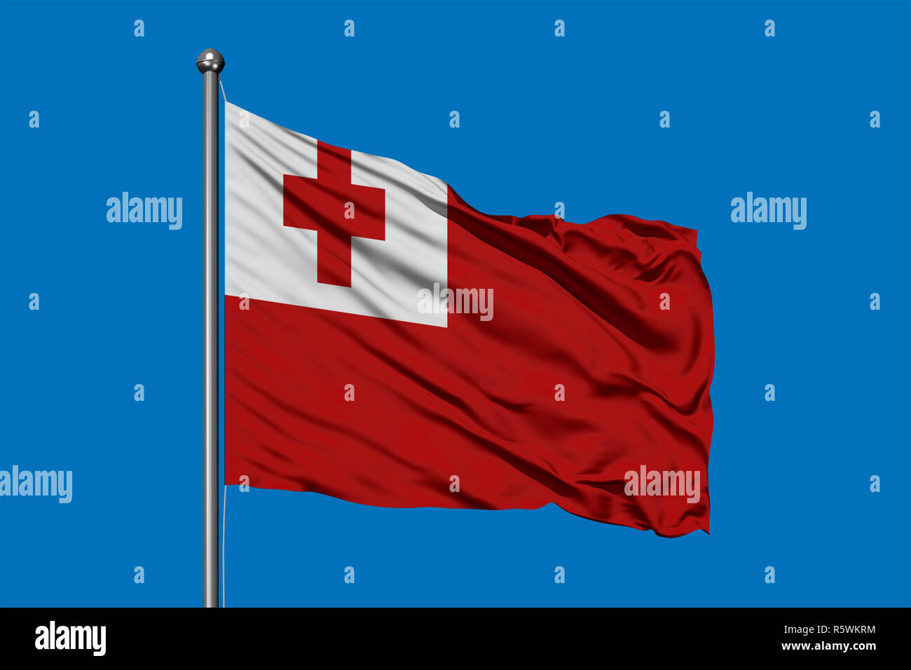 Flag of Tonga waving in the wind against deep blue sky Stock Photo - Alamy