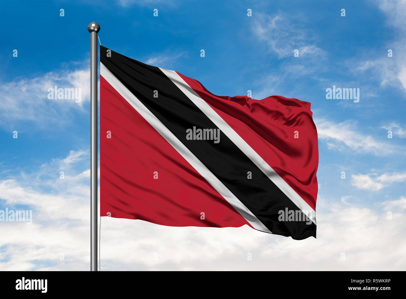 Flag of Trinidad and Tobago waving in the wind against white cloudy ...