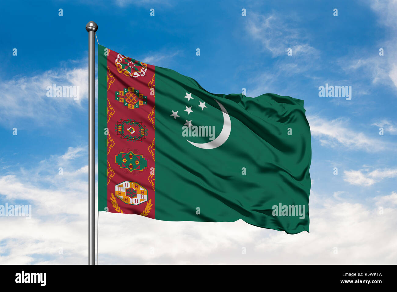 Flag Of Turkmenistan Waving In The Wind Against White Cloudy Blue Sky