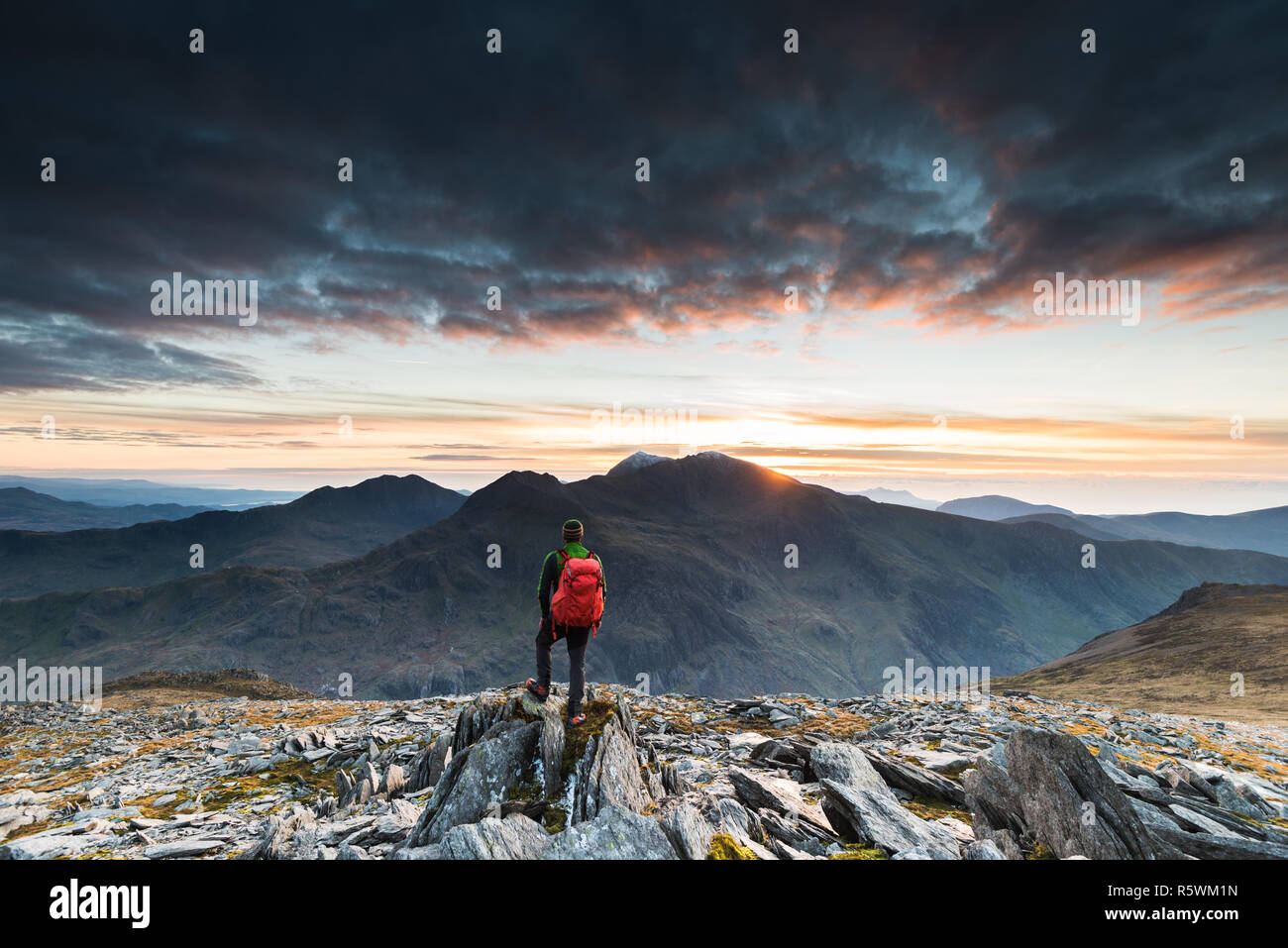 figure in the mountains of snowdonia, with snowdon in the background ...