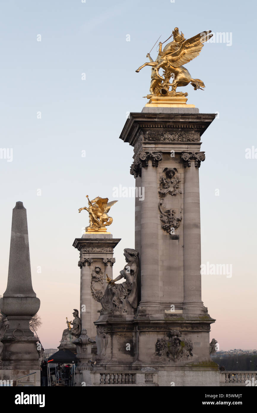 Two art nouveau golden-winged horses on the Pont Alexandre III, a deck ...