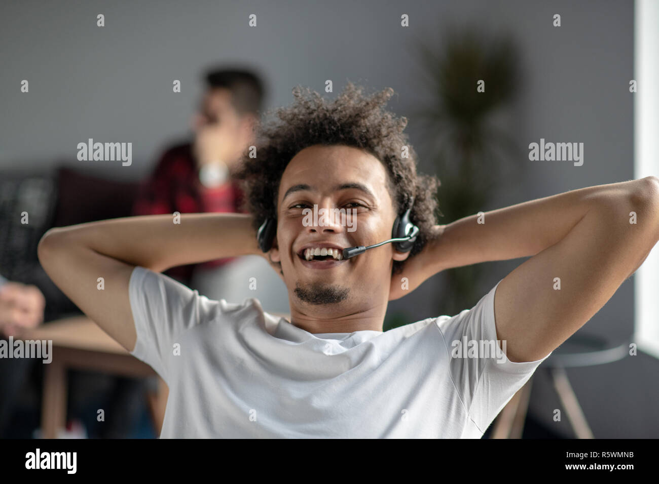 Satisfied relaxed african-american freelancer feeling happy at work ...