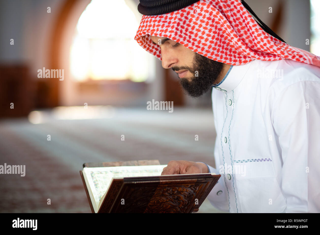 Muslim man reading koran in mosque hi-res stock photography and images ...