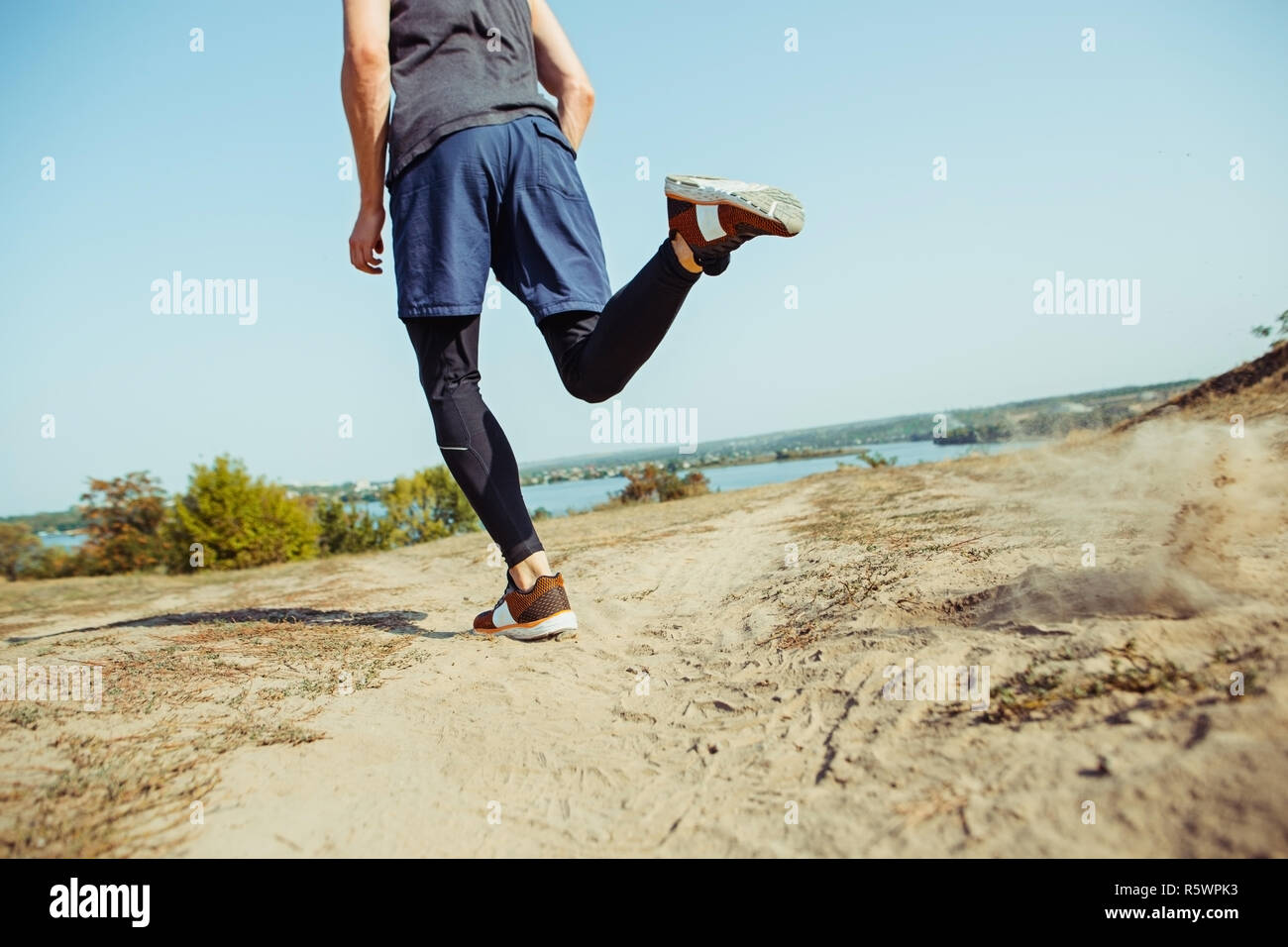 Running sport. Man runner sprinting outdoor in scenic nature. Fit ...