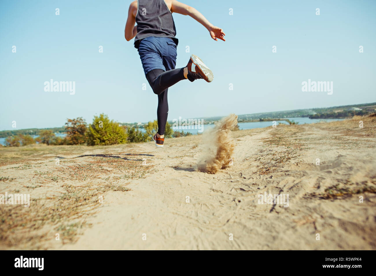 Running sport. Man runner sprinting outdoor in scenic nature. Fit ...