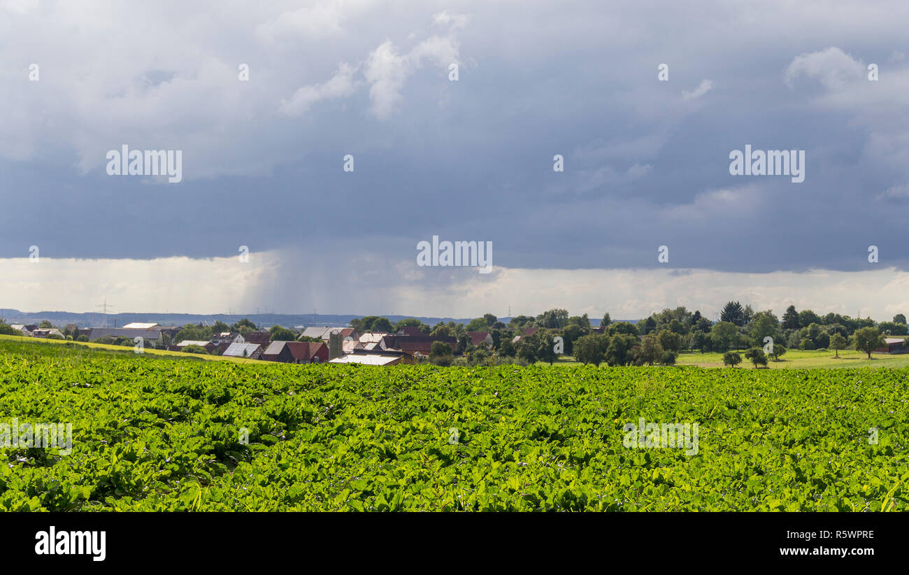 rainy scenery with small village Stock Photo - Alamy