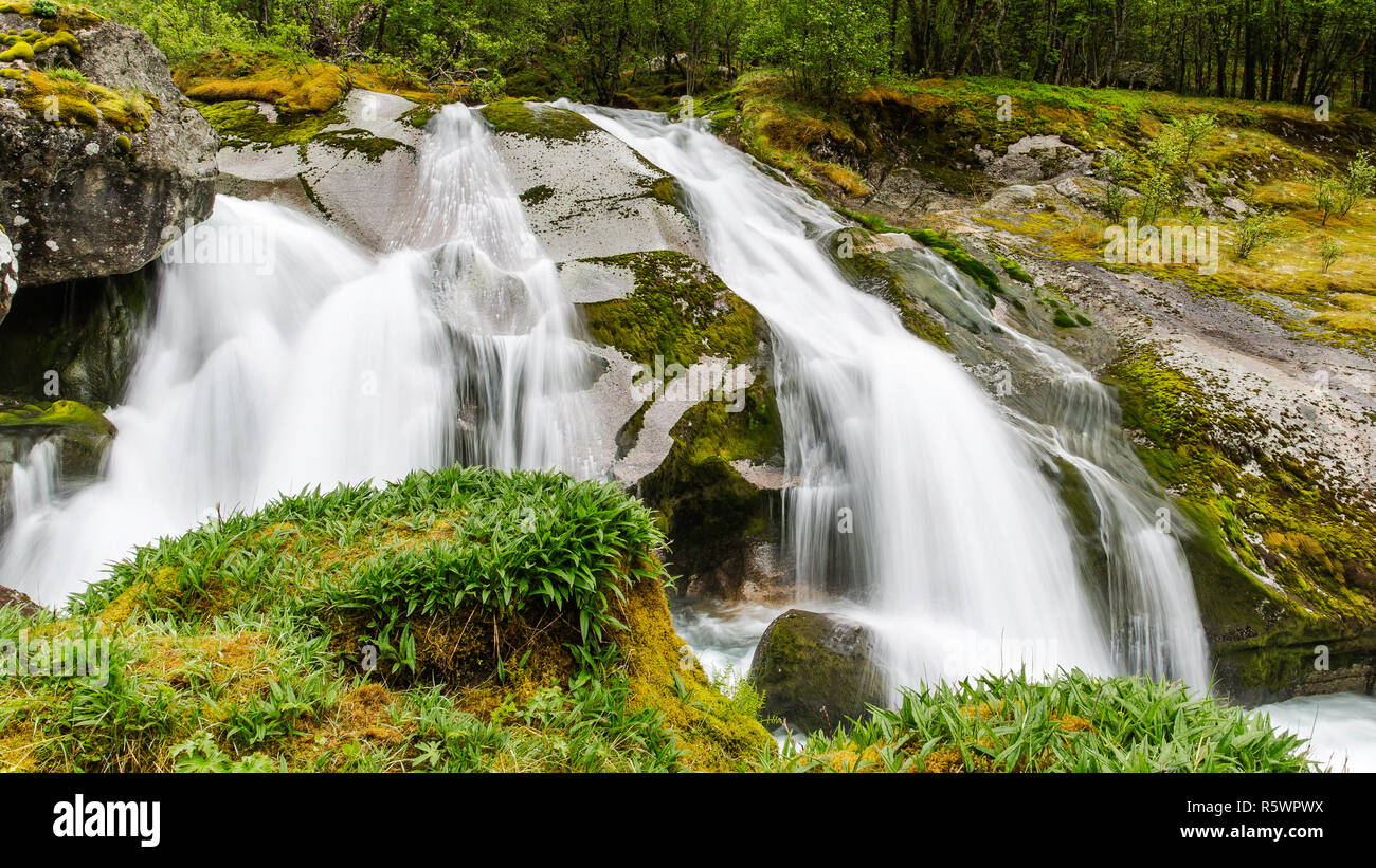 Snowmelt river running strongly in Briksdal Valley, Olden, Norway Stock ...