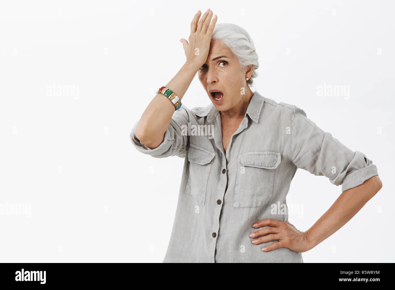 Old lady being shocked with how dumb teenagers are. Portrait of amazed ...