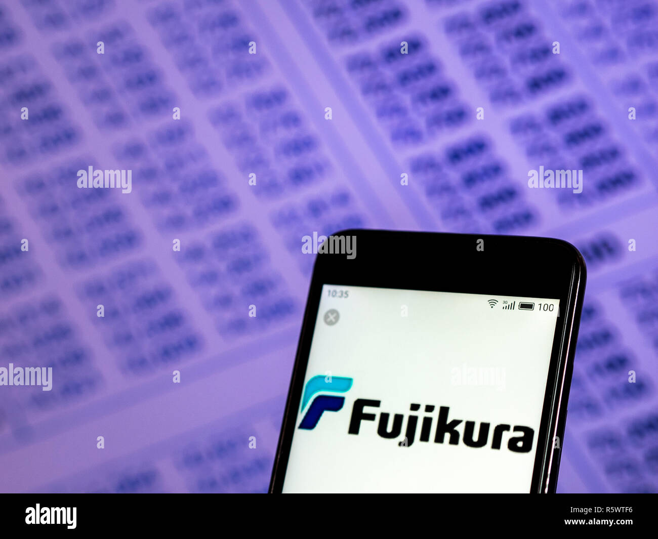 Fujikura Telecommunications company logo seen displayed on smart phone ...