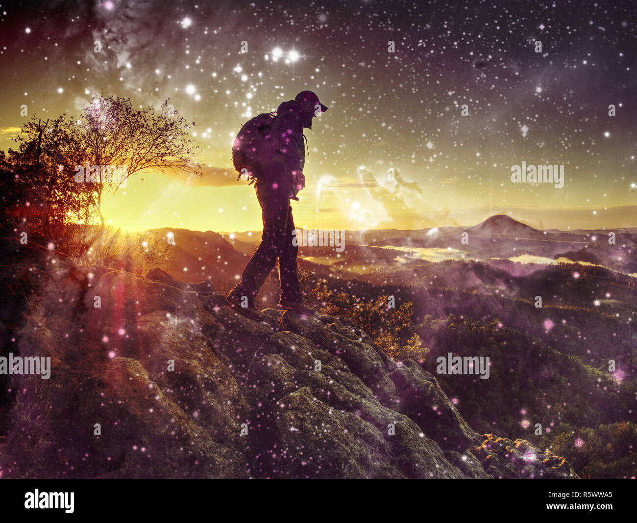 Abstract, over filtered. Man walking on the edge of sharp cliff high ...