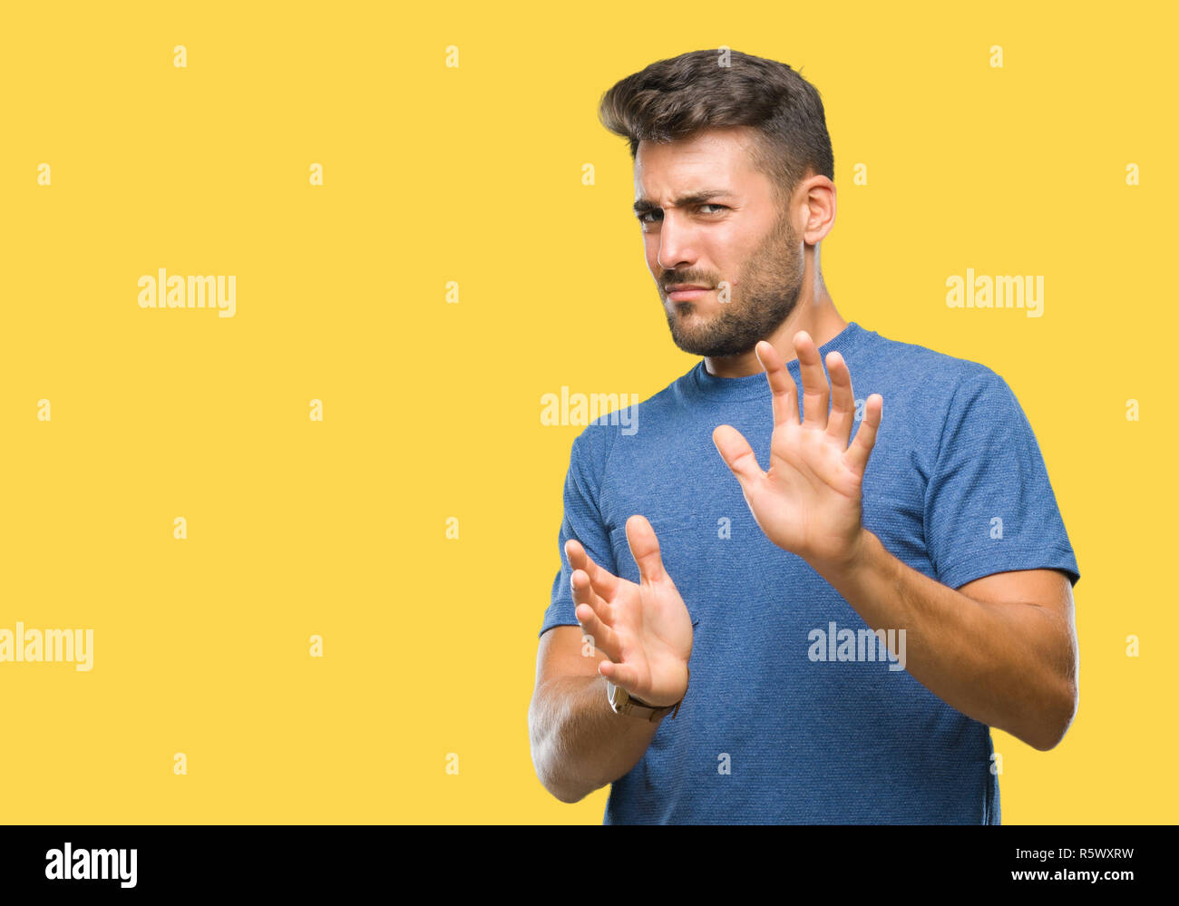 Young handsome man over isolated background disgusted expression ...
