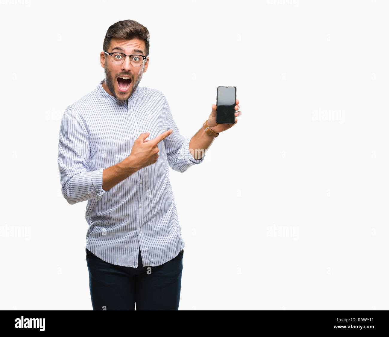 Young handsome man texting using smartphone over isolated background ...