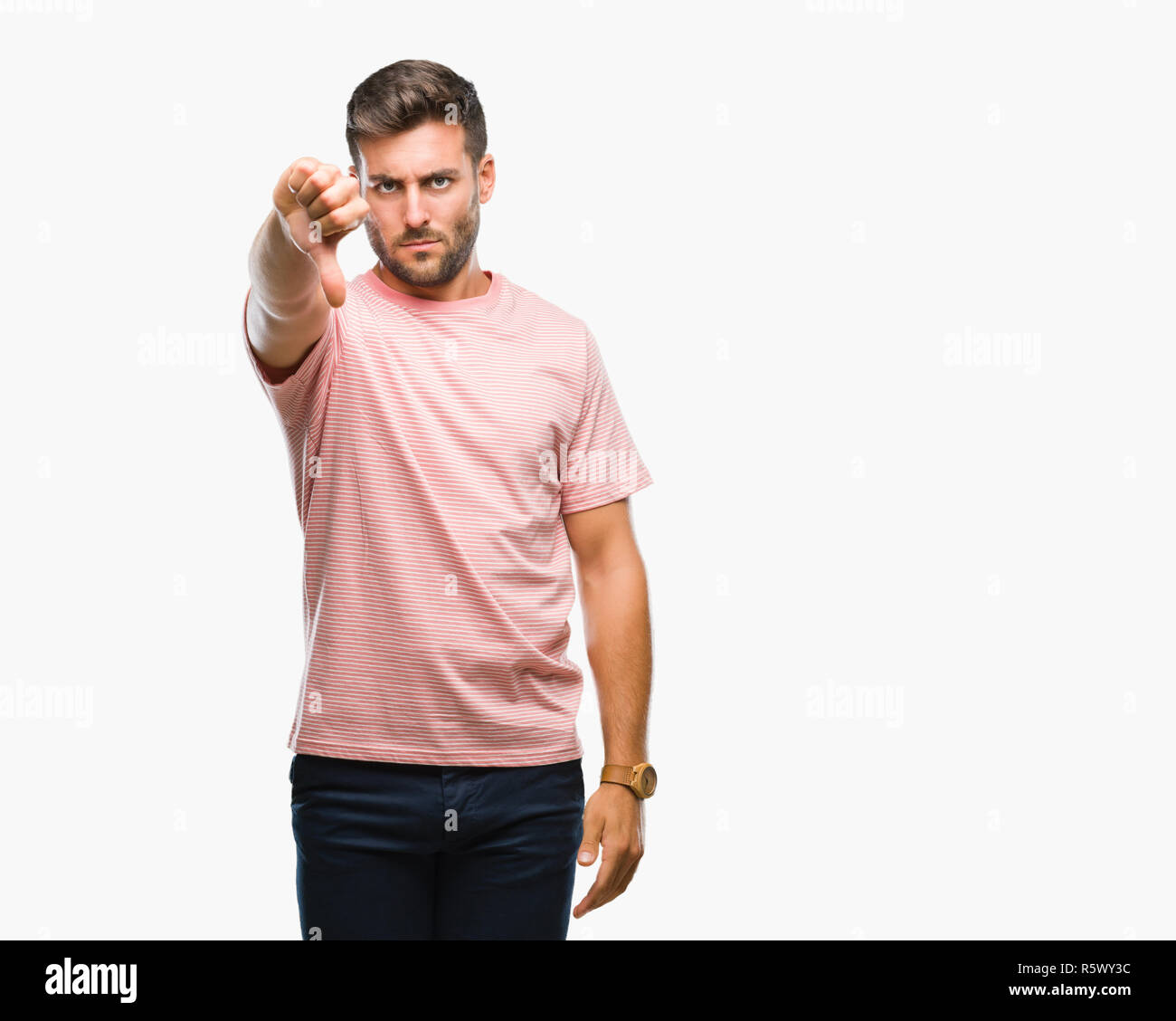 Young handsome man over isolated background looking unhappy and angry ...