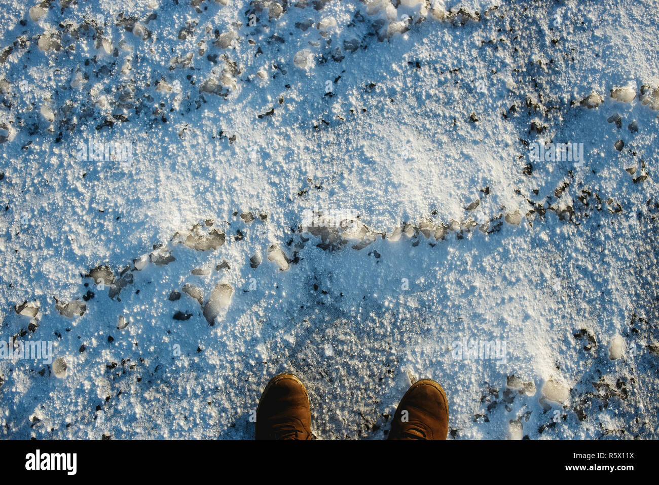 Men's winter boots on a background of rough ice. Top view Stock Photo ...