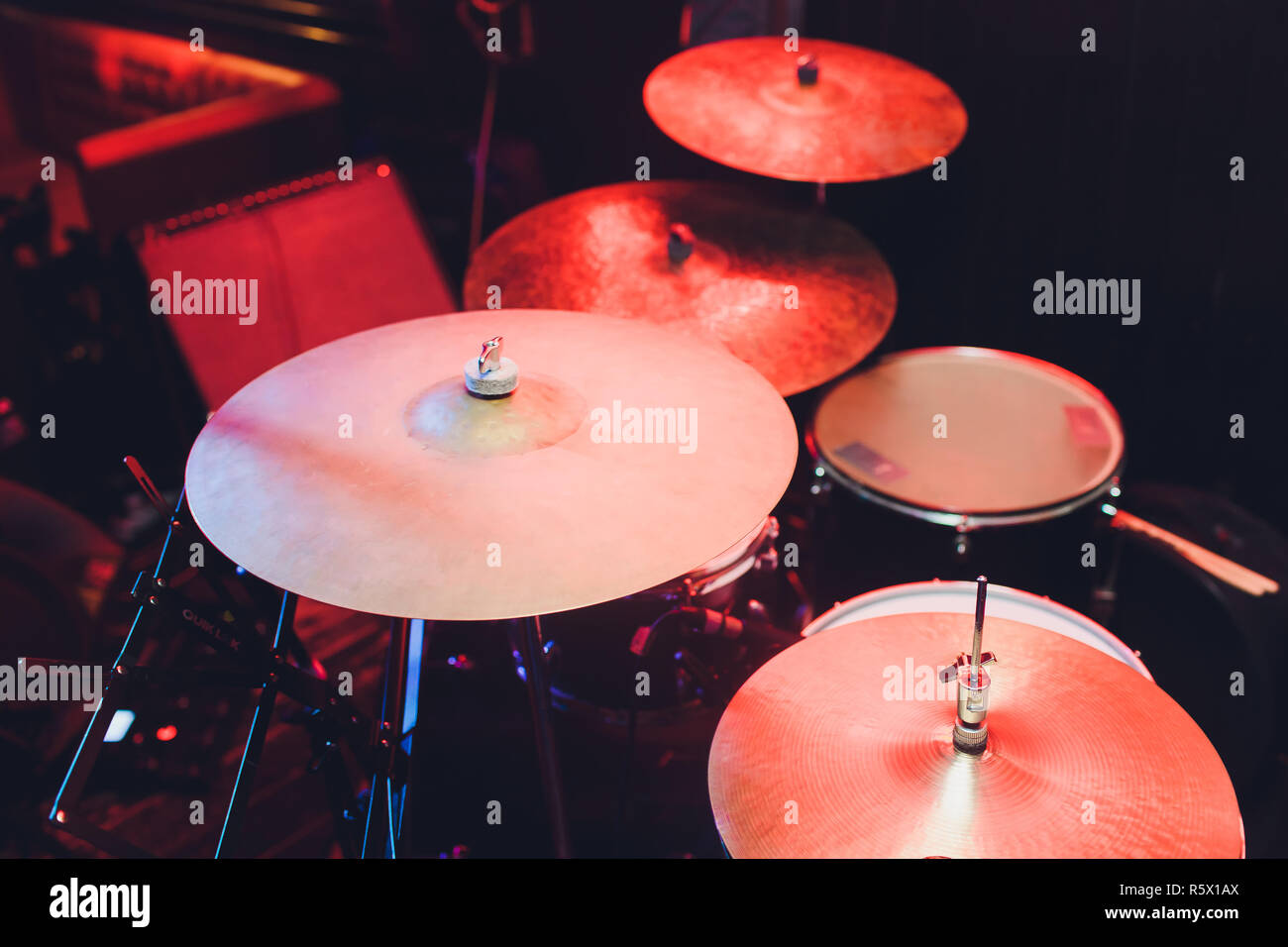 Modern drum set shot in smoky dark studio Stock Photo - Alamy