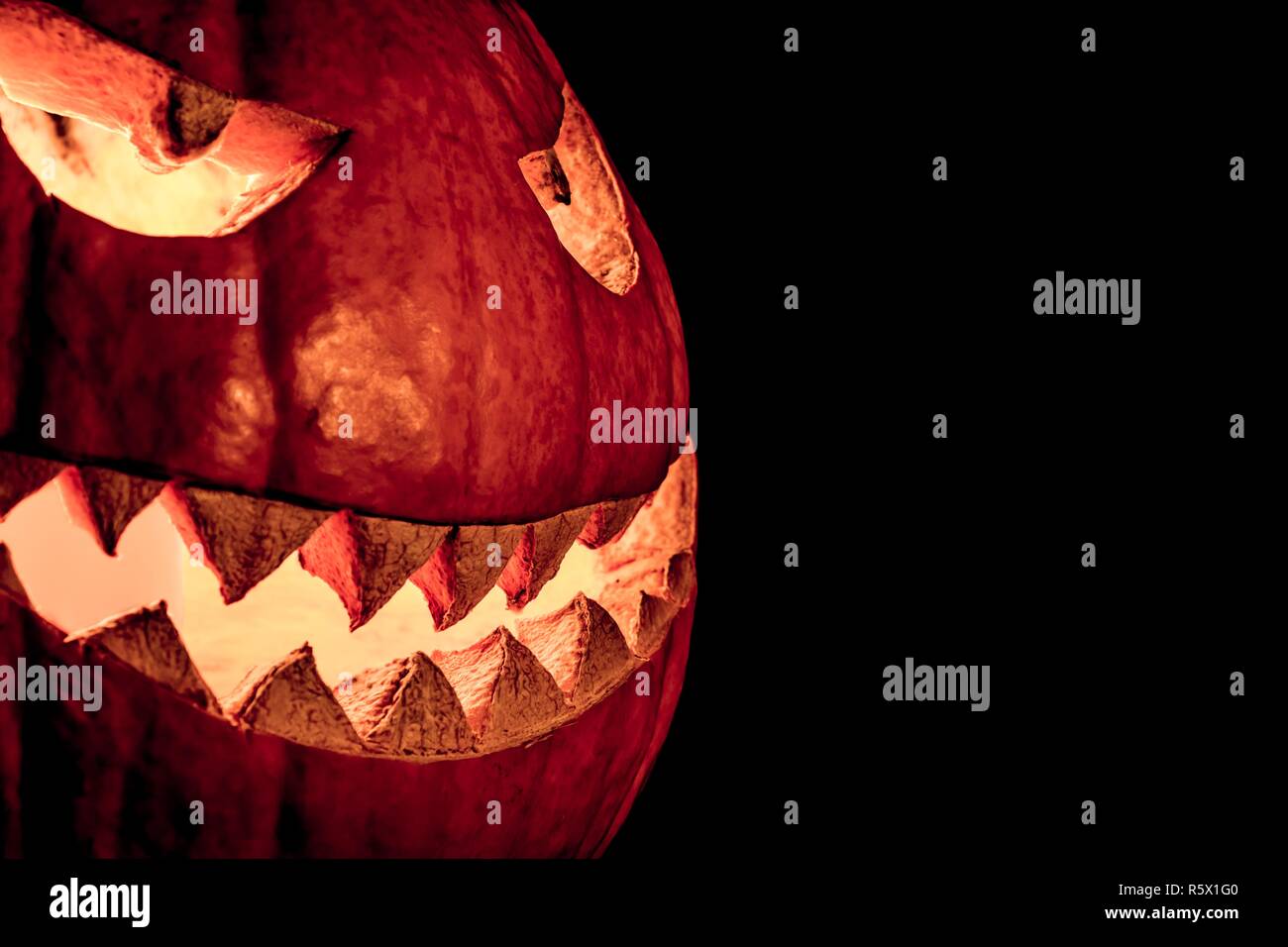 Side view halloween pumpkin smile with fire burning eyes mouth Stock ...