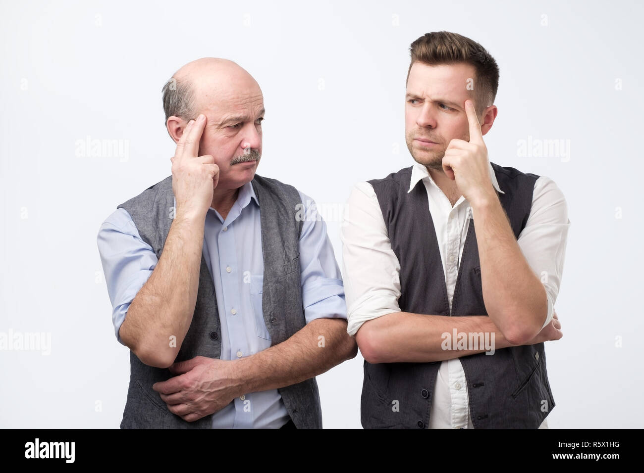 Two mature men thinking together about problem Stock Photo - Alamy