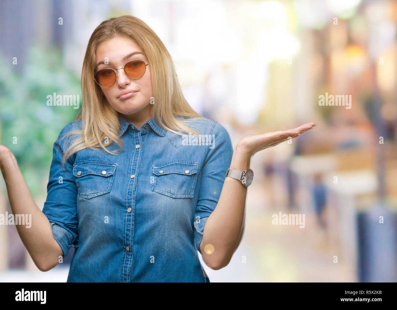 Young caucasian woman wearing sunglasses over isolated background ...