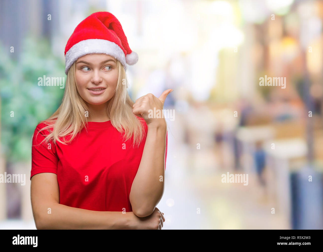 Young caucasian woman wearing christmas hat over isolated background ...