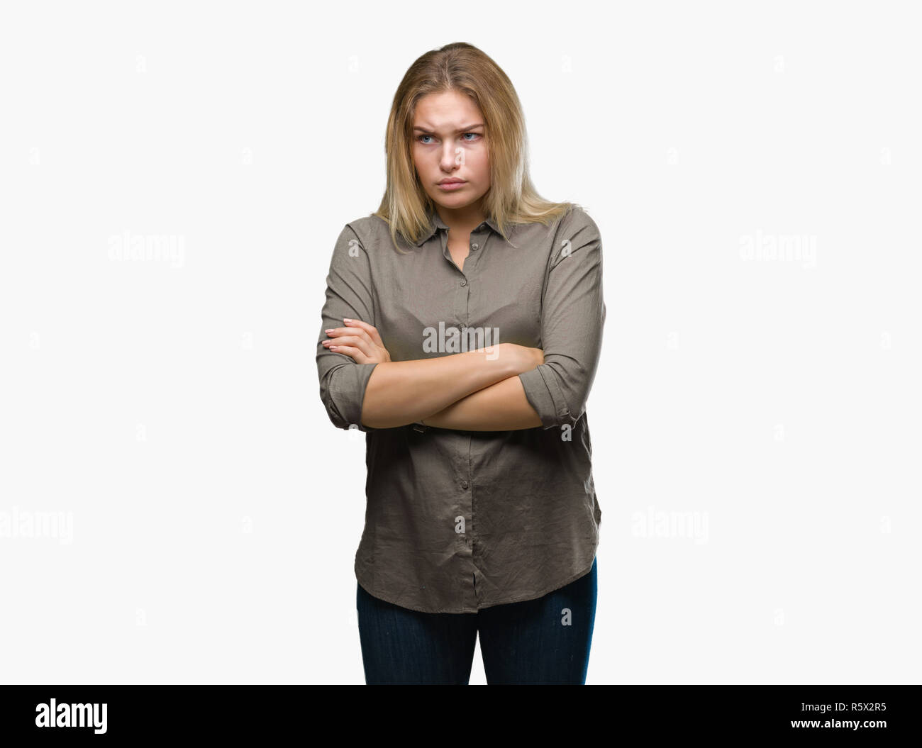 Young caucasian business woman over isolated background skeptic and ...