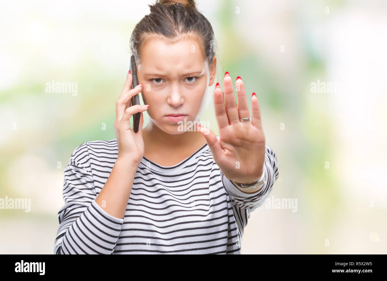 Young beautiful caucasian woman talking on smartphone over isolated ...