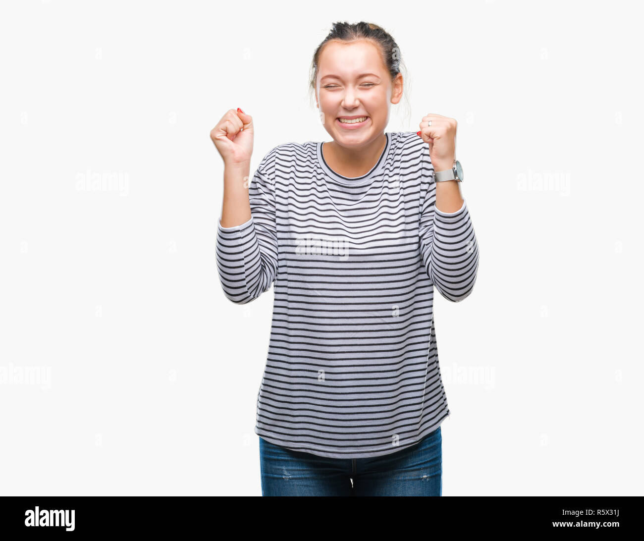 Young beautiful caucasian woman over isolated background celebrating ...