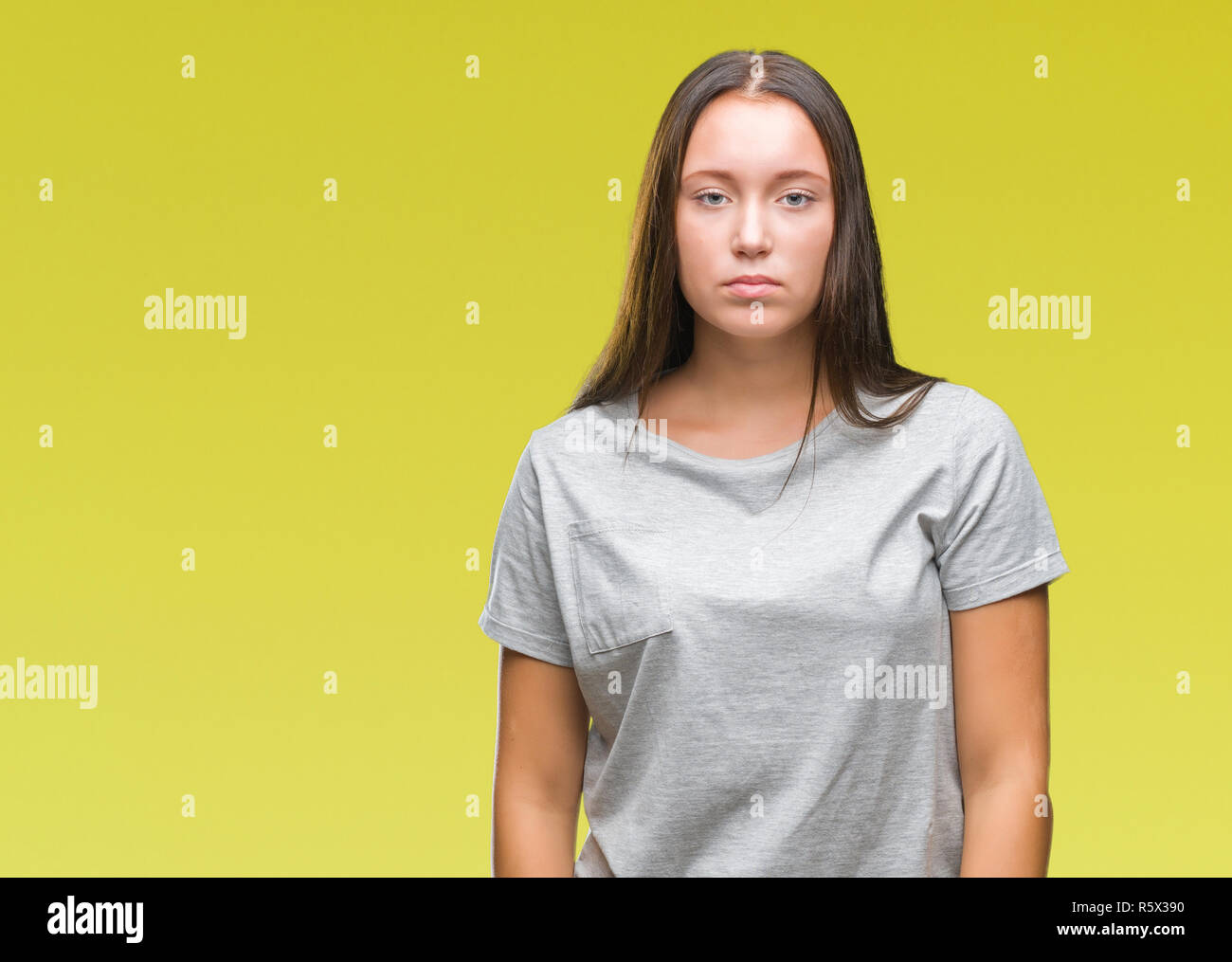 Young caucasian beautiful woman over isolated background with serious ...