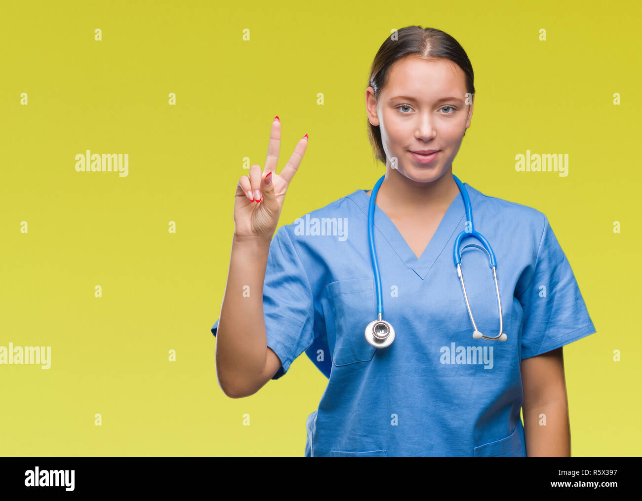Young caucasian doctor woman wearing medical uniform over isolated ...