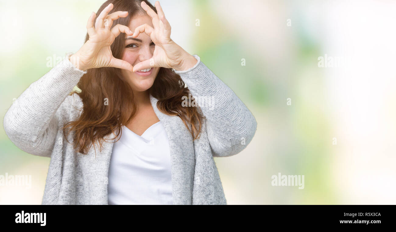 Beautiful plus size young woman wearing winter jacket over isolated ...