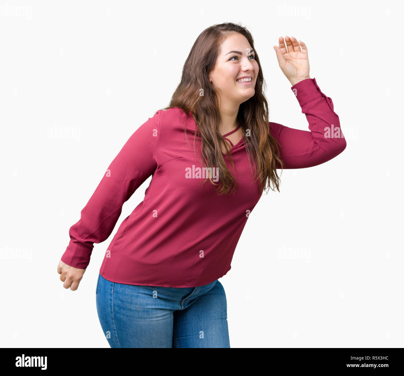 Beautiful plus size young woman over isolated background Dancing happy ...