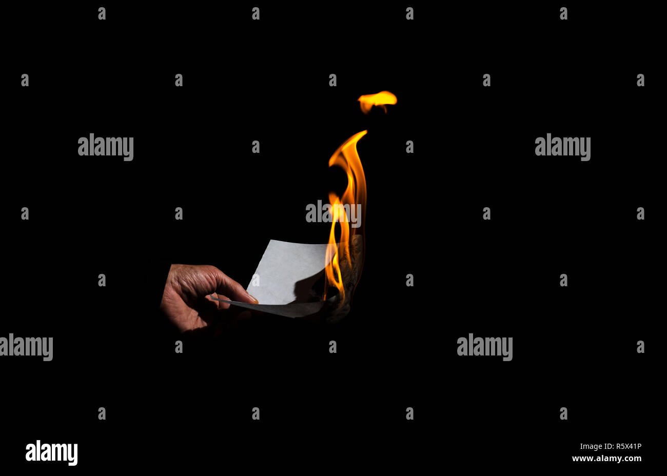 Hand burn paper hi-res stock photography and images - Alamy