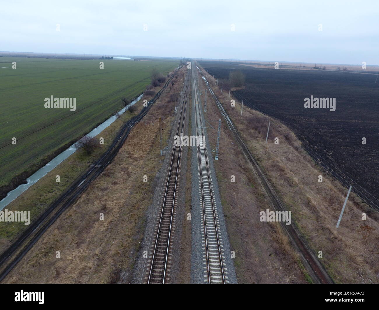 Plot railway. Top view on the rails. High-voltage power lines for ...